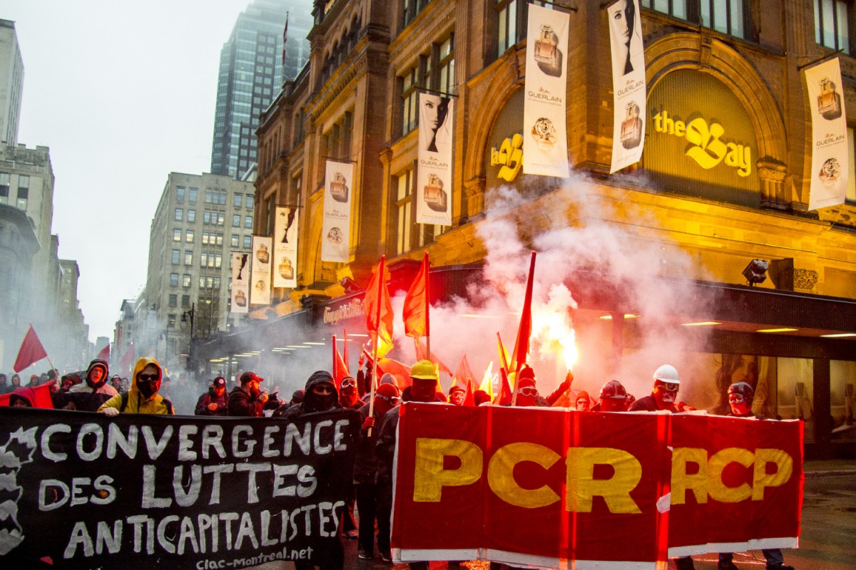 Anti-Capitalist Protesters Endure the Rain in Downtown Montreal | News ...